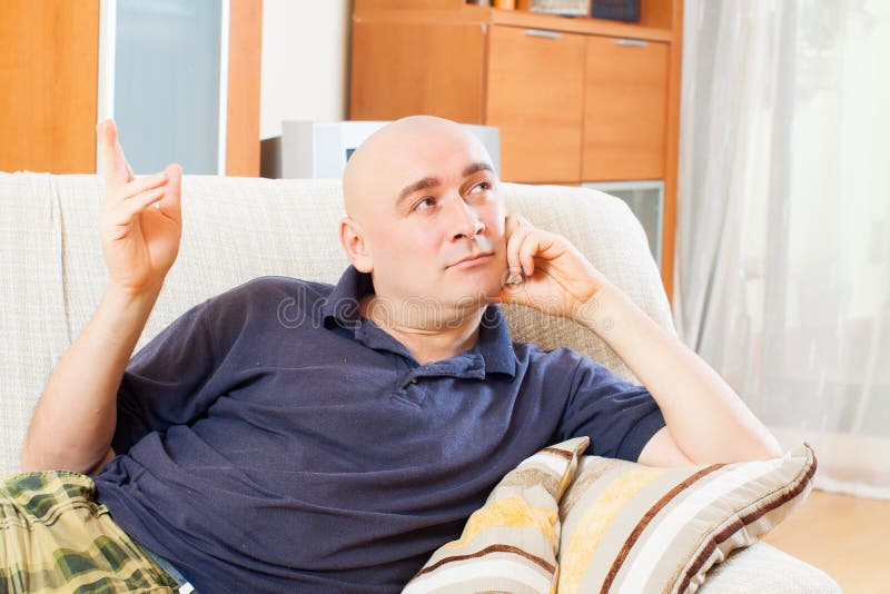 Man on sofa stock image. Image of wardrobe, comfortable - 37443811
