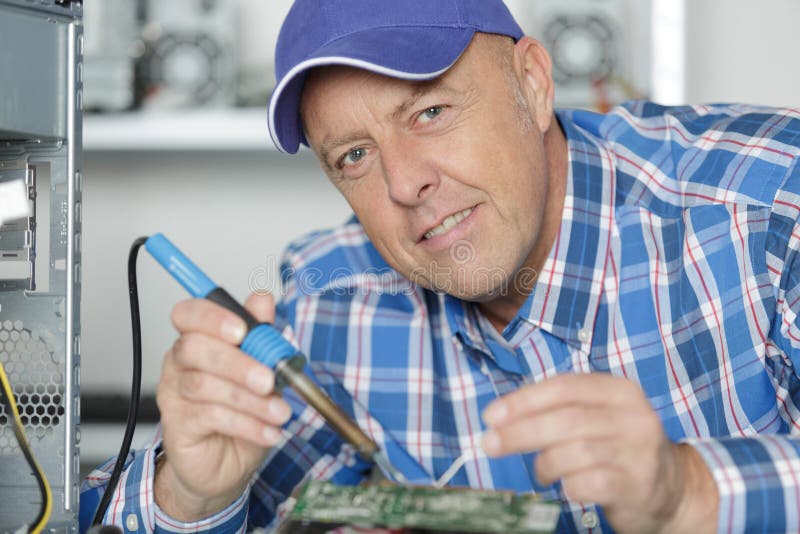 Man Soldering Computer Parts Stock Photo - Image of technology, tech ...