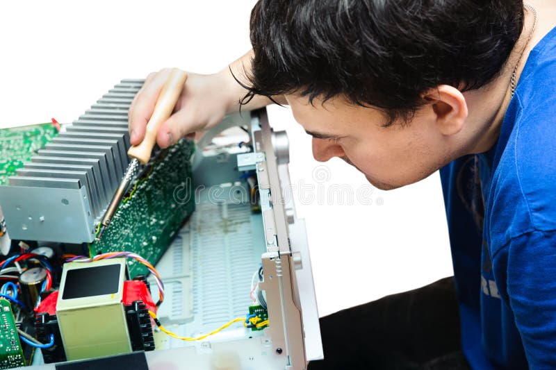 A Man with a Soldering Iron To Repair Electronic Device Stock Image ...