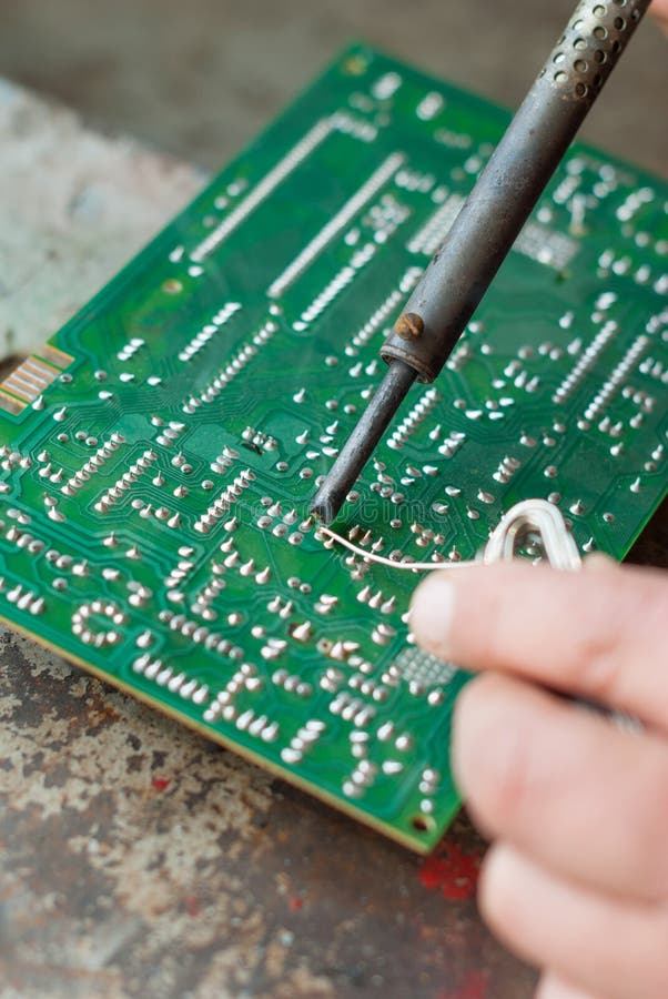 Man with Soldering Iron To Solder Electronic Board. Stock Photo - Image ...