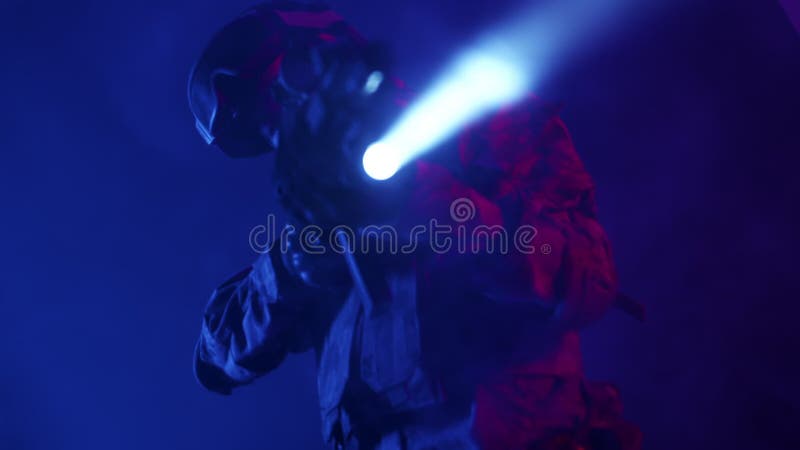 Man Soldier in Military Uniform Shines a Rifle Flashlight Around ...