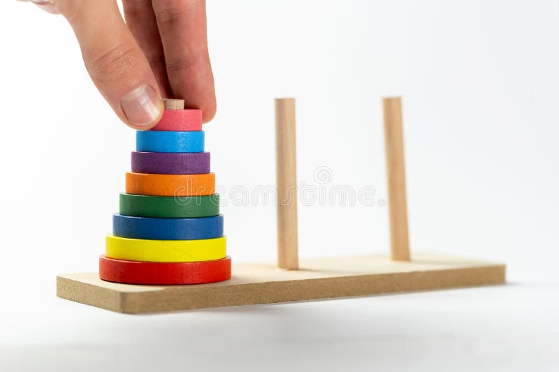 Man Solving A Tower Of Hanoi Moving Elements With His Hand Puzzle Recursive Algorithm Computer