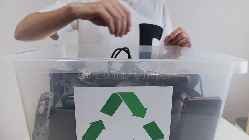 Man Sorting Broken Household Electrical and Scrapped Electronic Devices ...