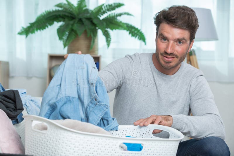 Man Sorting Laundry in Basket Stock Photo - Image of cleanliness, home ...