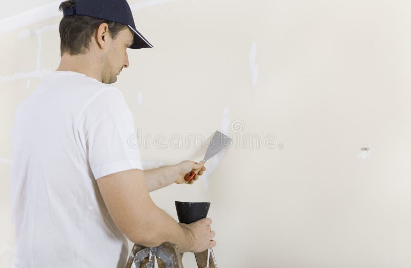 Man Spackles Cracks in Wall Stock Photo - Image of ladder, surface ...