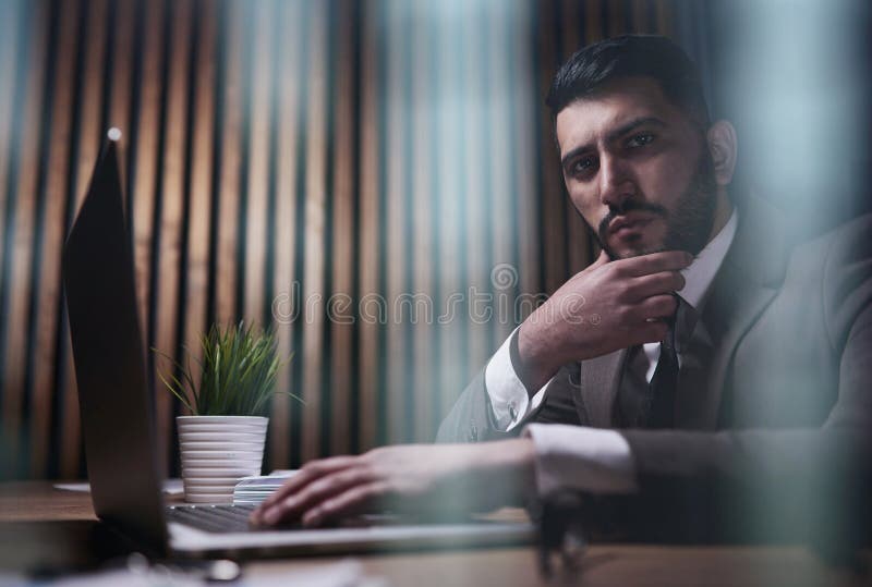 A Man of Spanish Appearance Works at the Office with a Laptop Stock ...