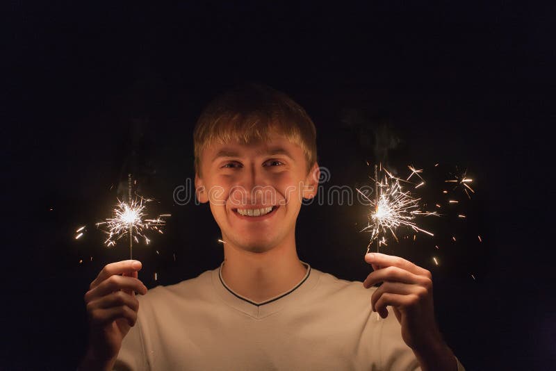 Man with sparklers stock image. Image of dark, fire, smiling - 80137765