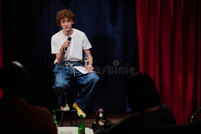 Man Speaking into Microphone during Live Performance Stock Image ...