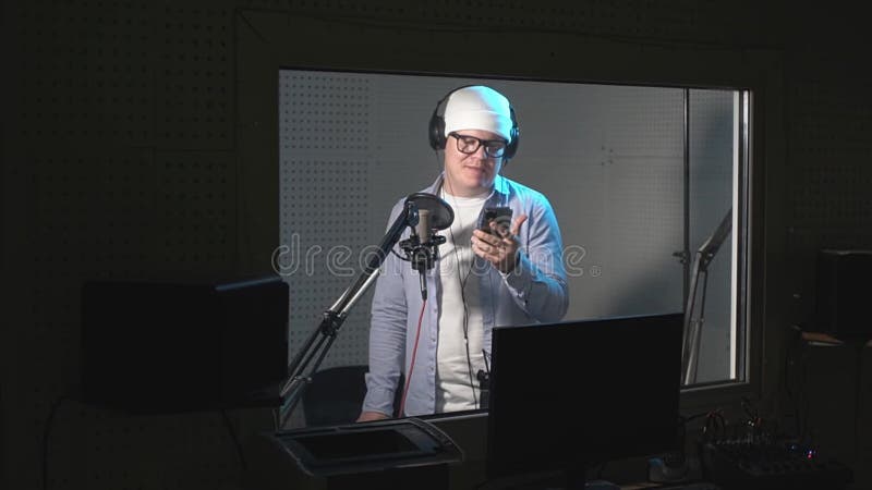 Man Speaking into a Microphone in a Recording Studio Stock Footage ...