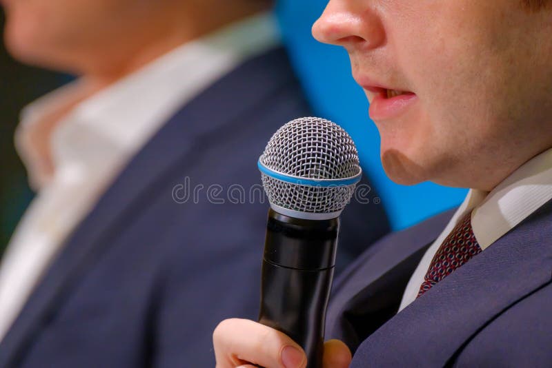 7,030 Man Holding Microphone Stock Photos - Free & Royalty-Free Stock ...