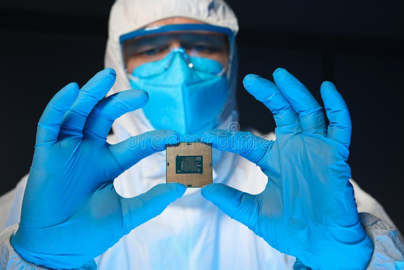 Man in Special Uniform Shows Microprocessor Chip Stock Photo - Image of ...