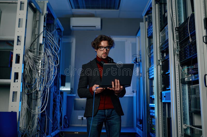 Man it Specialist with Laptop Working on Datacenter Software Update ...