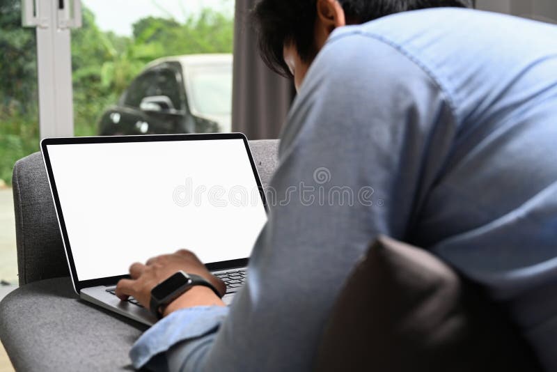 Man Spending Leisure Time at Home and Using Computer Laptop on Sofa ...