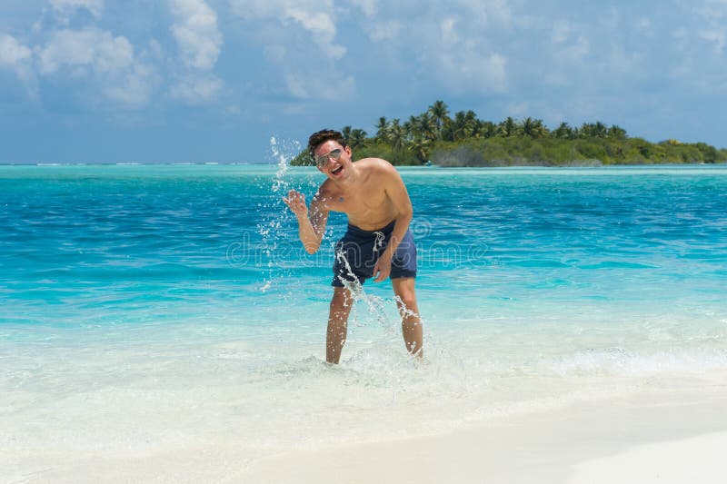 Man relaxing on beach stock image. Image of male, relaxation - 45240799