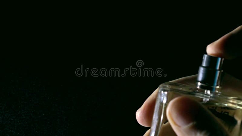 Spraying Perfume Against Black Background Super Slow Motion Dolly Shot ...