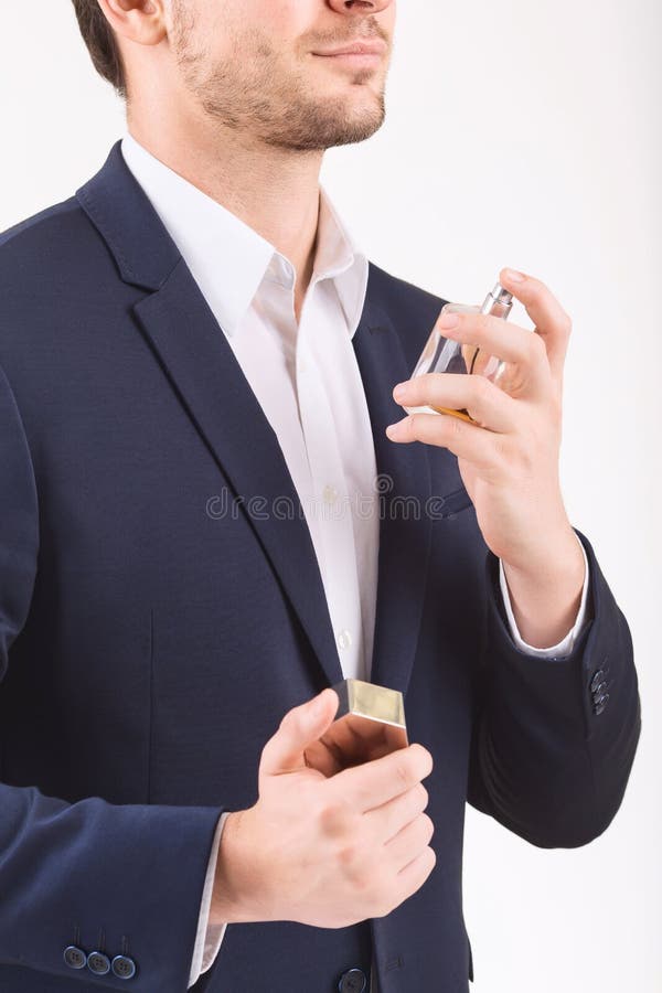 Man Spraying Perfume Over Himself Stock Photo - Image of businessman ...