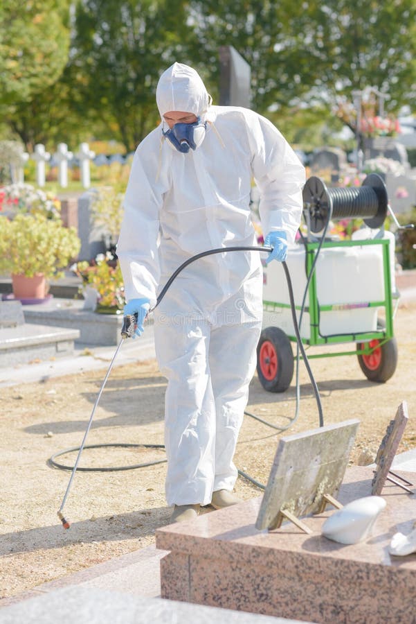 Man Spraying Weeds in Graveyard Stock Image - Image of poison, gravel ...