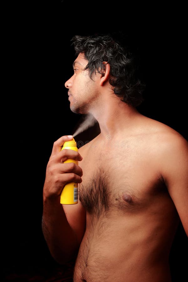 Man sprying deodorant stock photo. Image of nice, fashion - 14936212