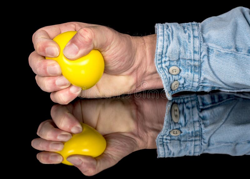 Man Squeezing Stress Ball Stock Photos - Download 57 Royalty Free Photos