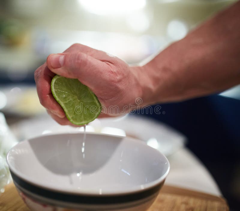 Man squeezing limes stock photo. Image of green, chopping - 68309194