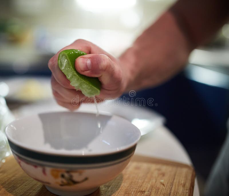 Man squeezing limes stock image. Image of chef, adult - 68309261