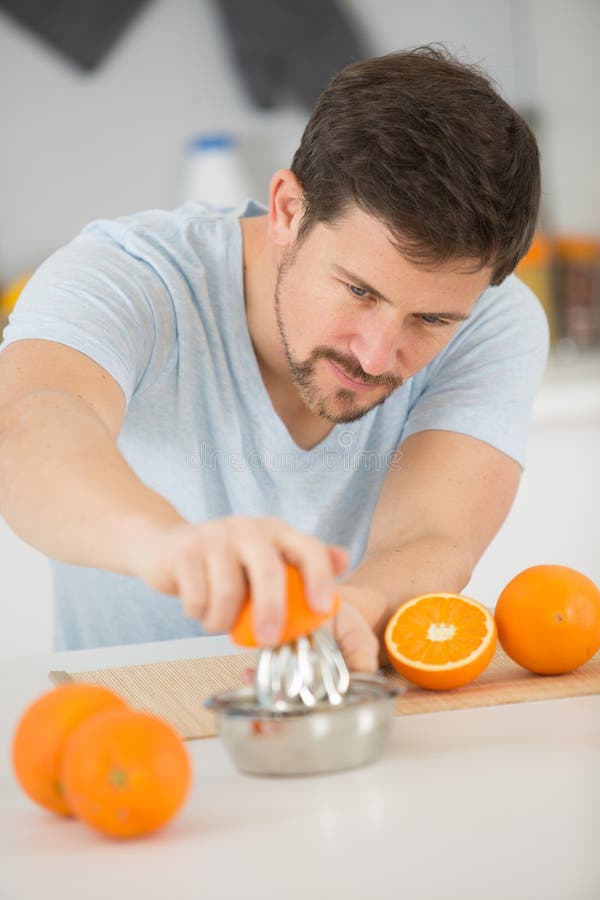 Man Squeezing Oranges for Their Juice Stock Image - Image of squeeze ...