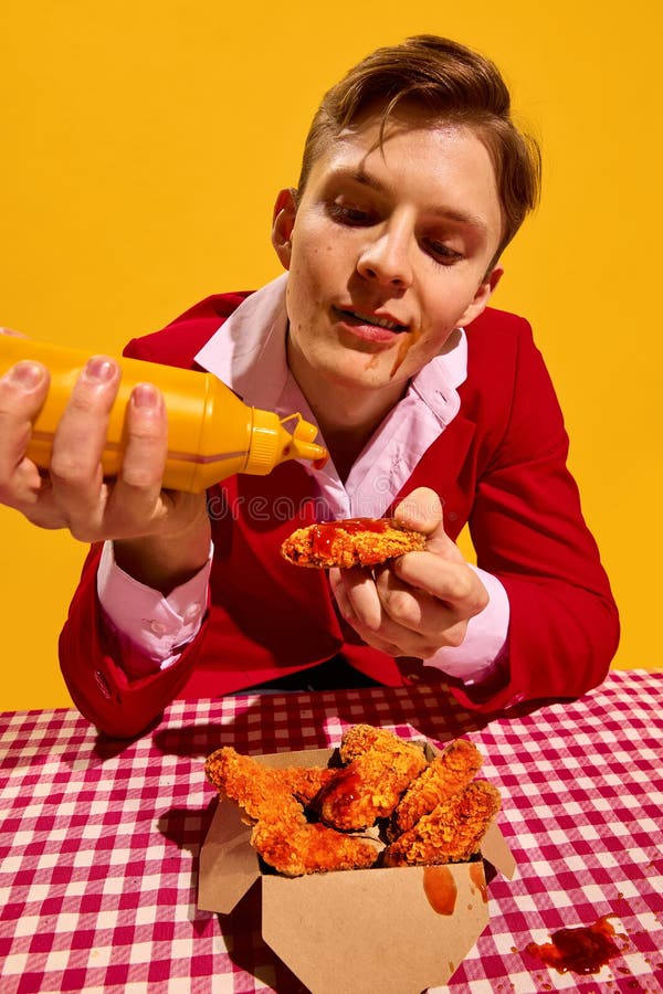 Man Squeezing Sauce on Fried Chicken Nuggets with Humorous Expression ...