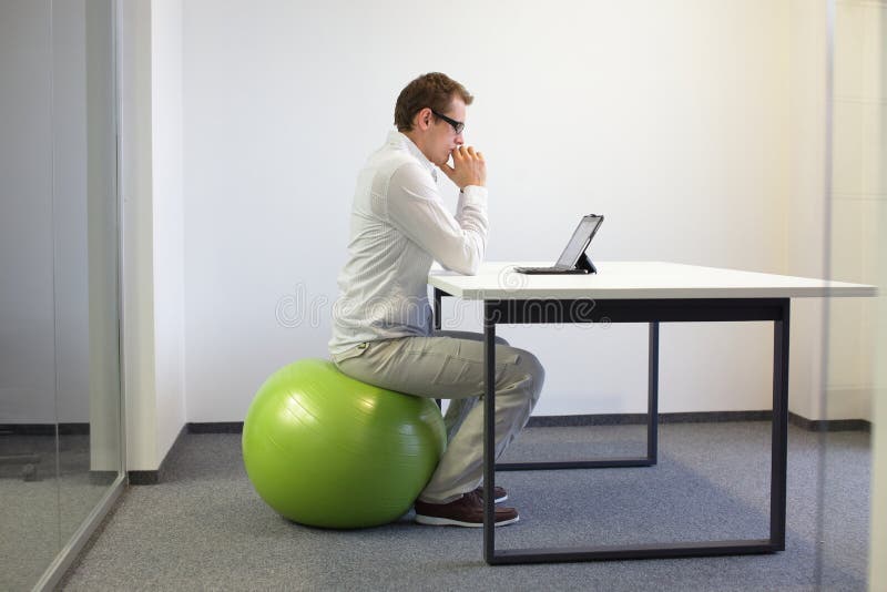 Man on Stability Ball Working with Tablet Stock Photo - Image of ...