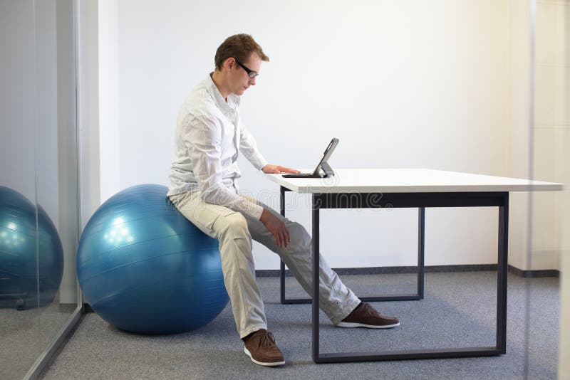Man on Stability Ball Working with Tablet Stock Image - Image of desk ...