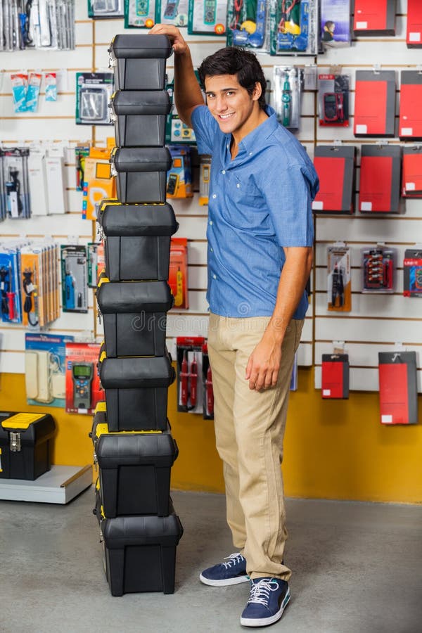 Man with Stacked Toolboxes in Hardware Store Stock Image - Image of ...