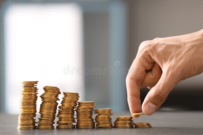 Man Stacking Coins on Table, Closeup Stock Image - Image of person ...