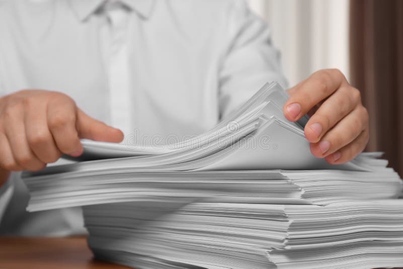 Man Stacking Documents in Office, Closeup View Stock Photo - Image of ...