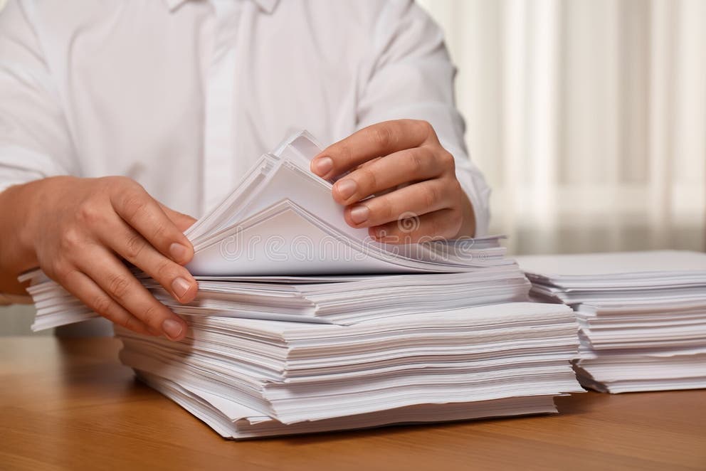 Man Stacking Documents at Table in Office, Closeup Stock Photo - Image ...
