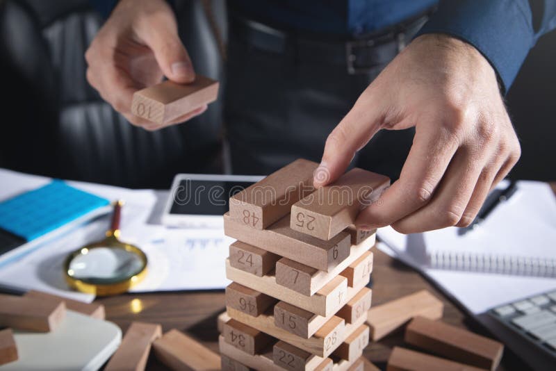 Man Stacking a Wooden Blocks. Business. Plan Stock Photo - Image of ...