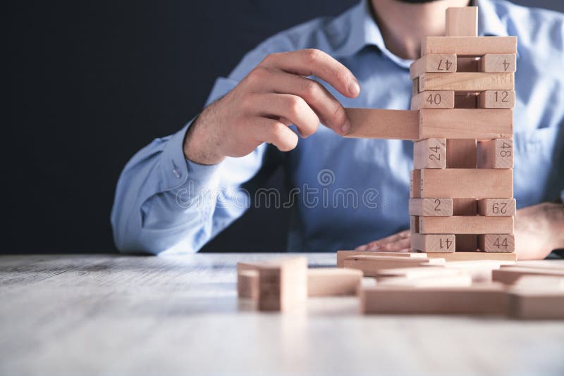Man Stacking Wooden Blocks. Development Concept Stock Image - Image of ...