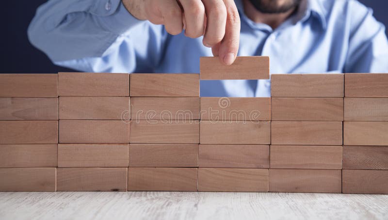 Man Stacking Wooden Blocks. Development Concept Stock Image - Image of ...