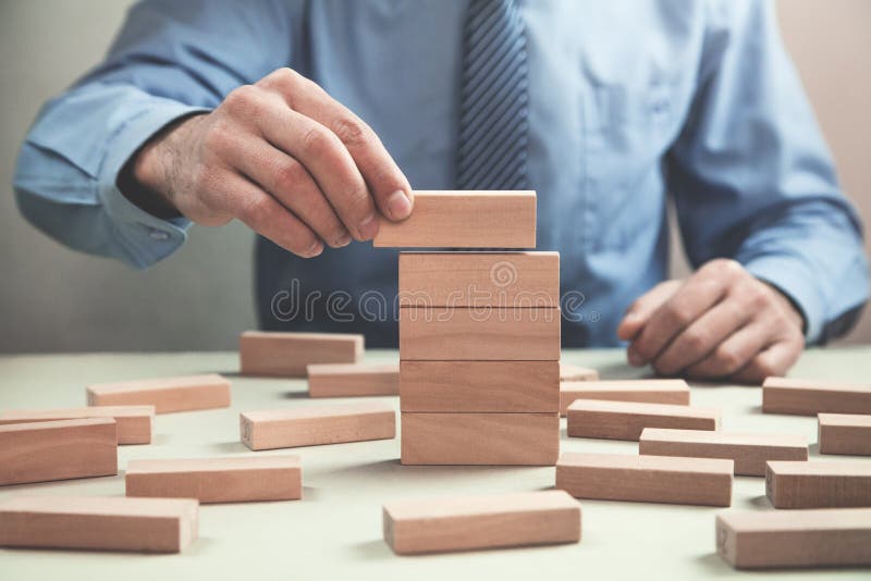 Man Stacking Wooden Blocks. Development Concept Stock Image - Image of ...