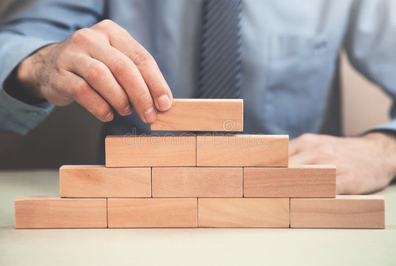Man Stacking Wooden Blocks. Development Concept Stock Photo - Image of ...