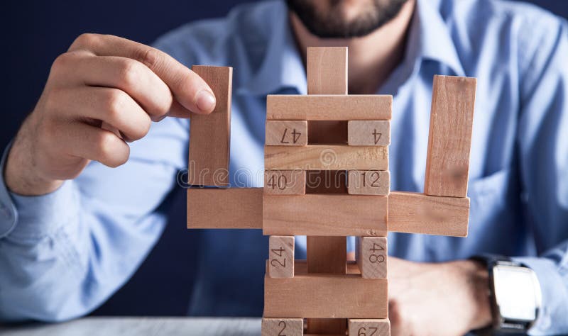 Man Stacking Wooden Blocks. Development Concept Stock Image - Image of ...