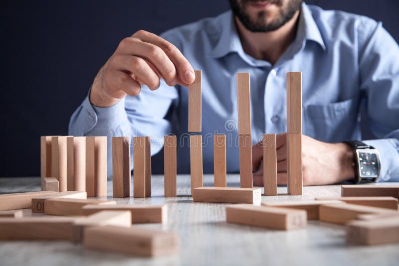 Man Stacking Wooden Blocks. Development Concept Stock Image - Image of ...