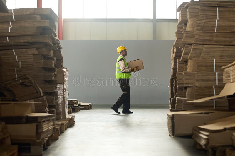 Man Stacks Cardboard Sheets Stock Photos - Free & Royalty-Free Stock ...