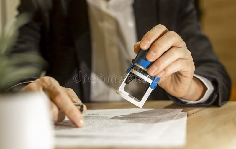 Stamping Document Close Up, Seal Over Contract in Male Hand Stock Image ...