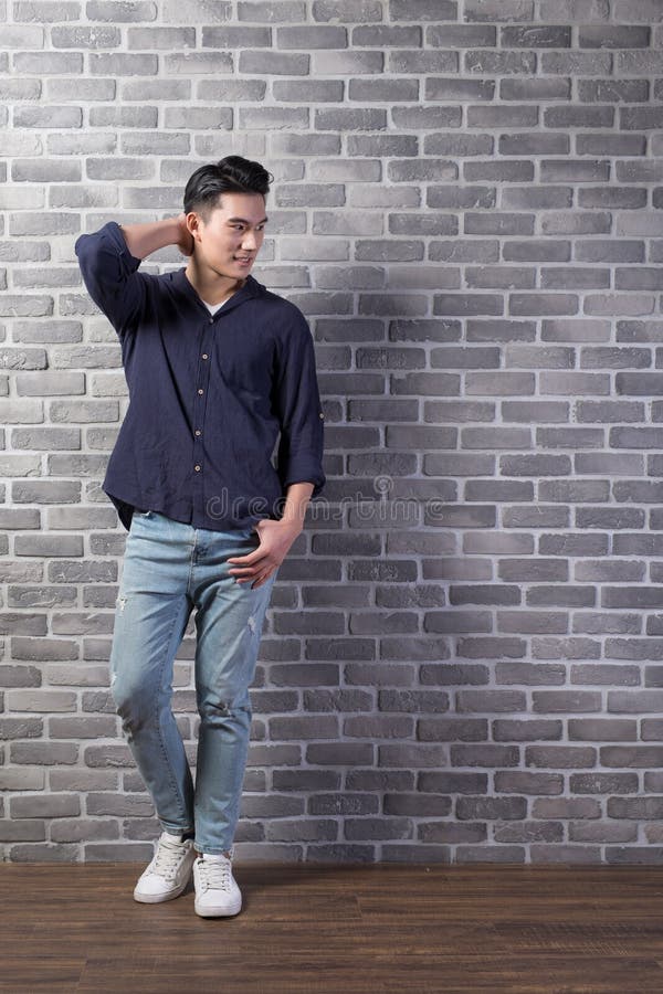 Man stand with brick wall stock photo. Image of japanese - 86874438