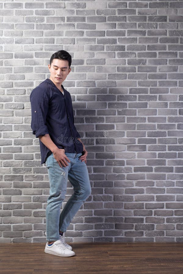 Man stand with brick wall stock image. Image of male - 86874531