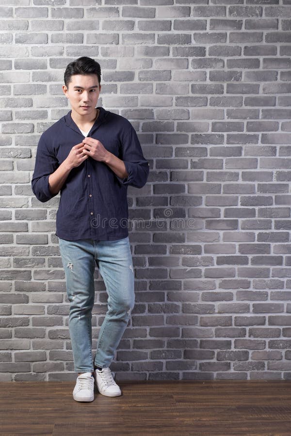 Man stand with brick wall stock image. Image of male - 87479237