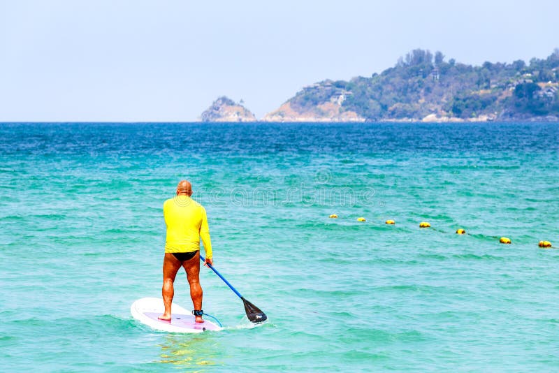 Man on Stand Up Paddle Board in Sea. Water Fun Editorial Stock Photo ...