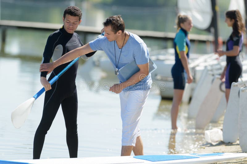 Man during Stand Up Paddle Training Stock Photo - Image of outside ...