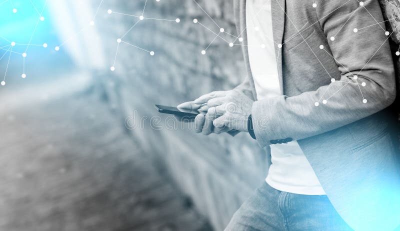 Man Standing Against a Wall and Using Mobile Phone Light Effect Stock ...