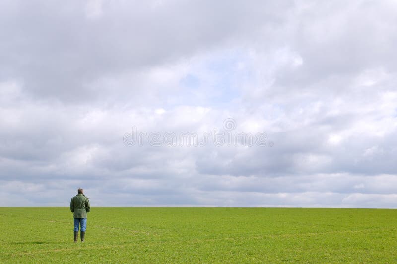 Man Standing Alone in a Field Stock Image - Image of person, season ...