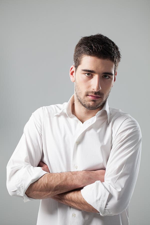 Man Standing with Arms Crossed Stock Image - Image of studio, white ...